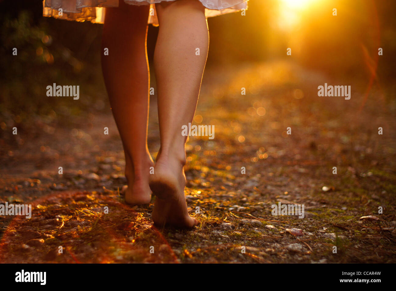 Feet Walking Down A Path