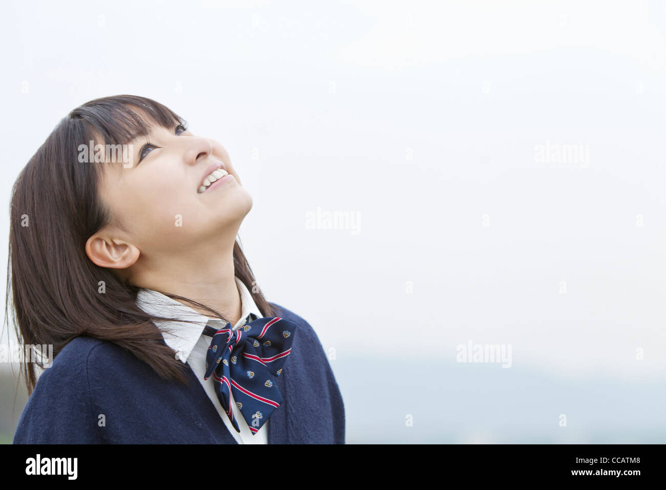 High school girl looking up Stock Photo - Alamy