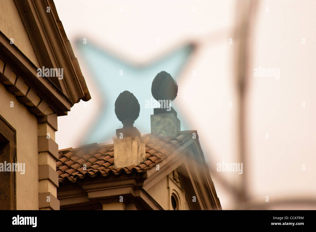 Distorted view of a rooftop through a blue glass Stock Photo - Alamy