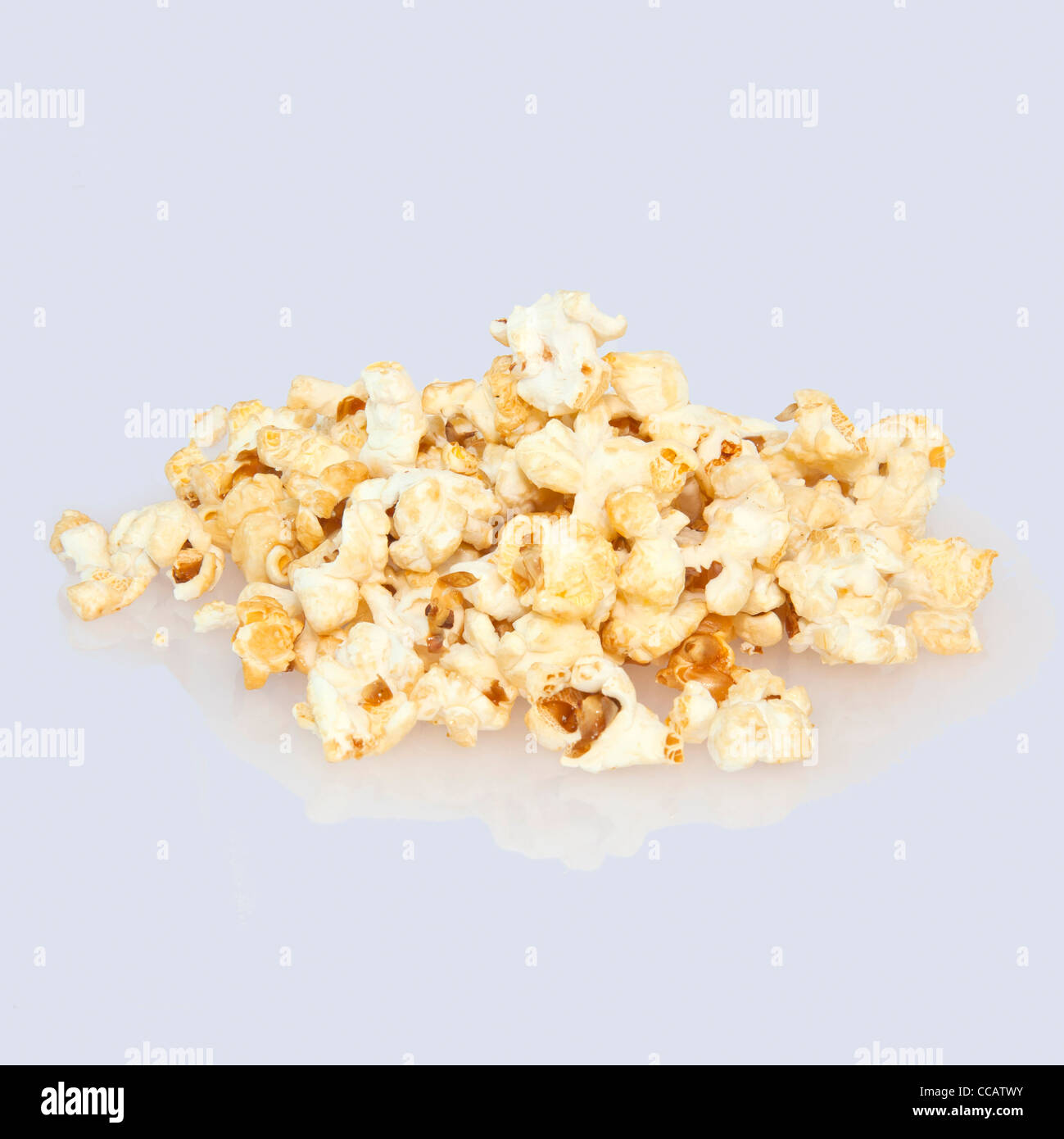 Popcorn over light grey with a reflection Stock Photo - Alamy