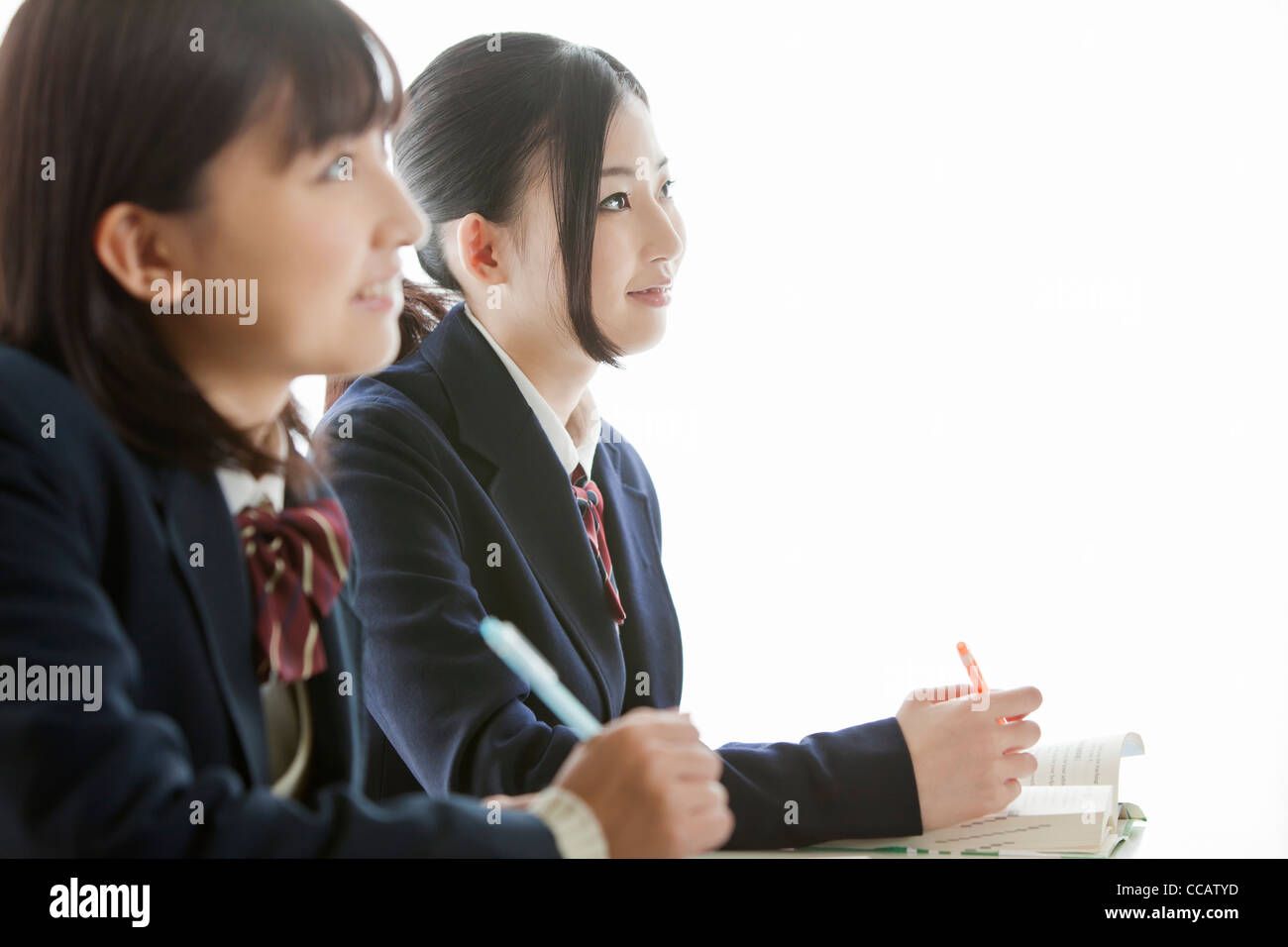 Two high school girls in class Stock Photo - Alamy