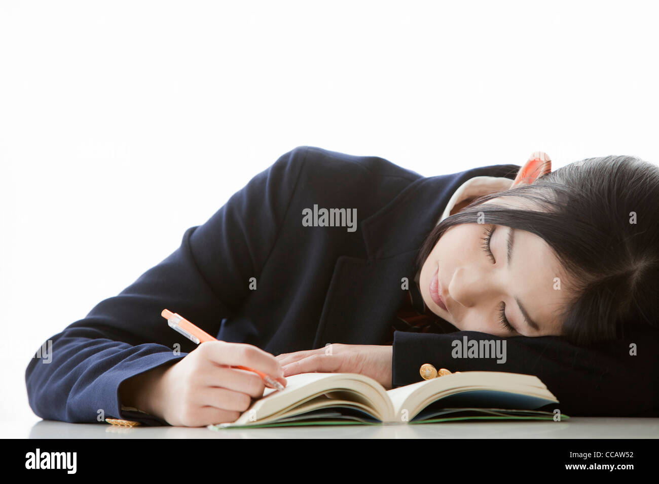Female Student Lying on Textbook Stock Photo - Alamy