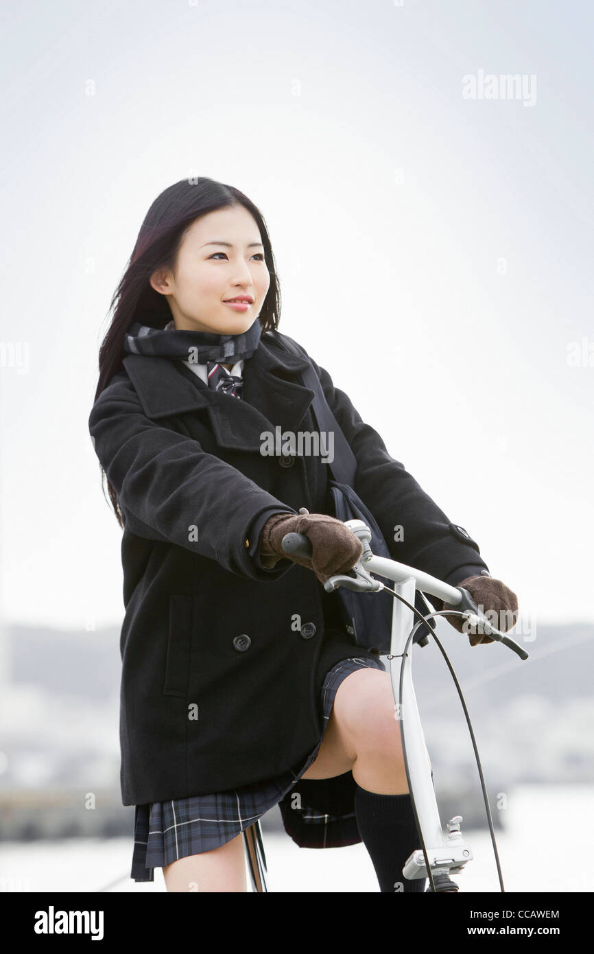 Girl cycling school uniform hi-res stock photography and images - Alamy