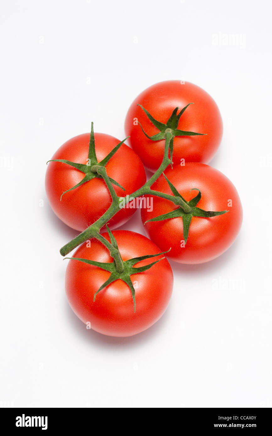 Vine cut tomatoes Cut Out Stock Images & Pictures - Alamy