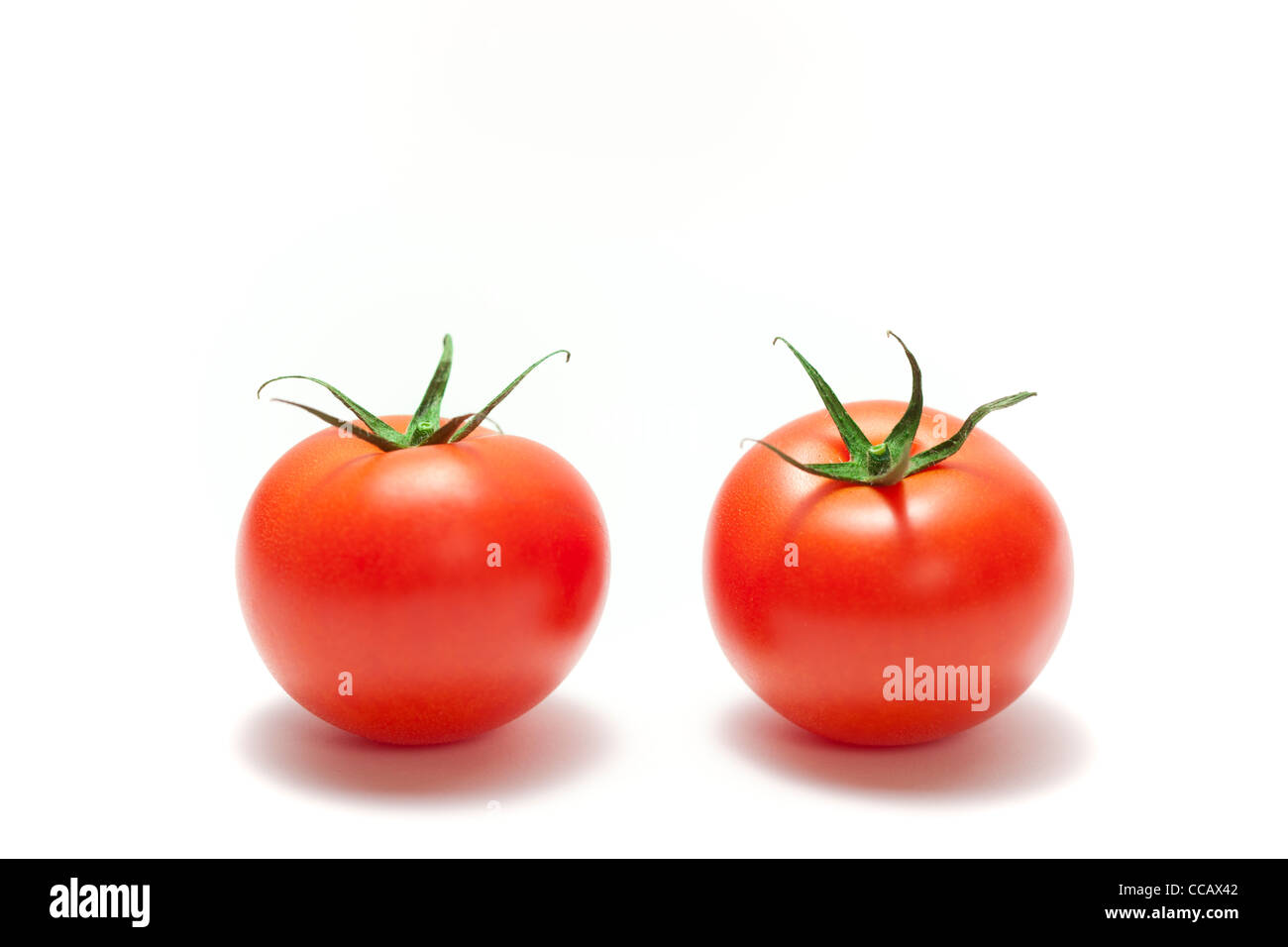 Two ripe red tomato Cut Out Stock Images & Pictures - Alamy