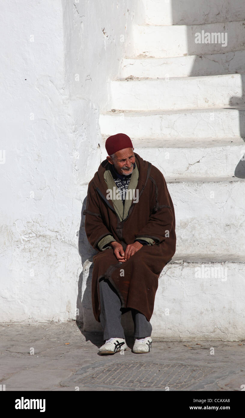 The old man sitting on the stairs Stock Photo - Alamy