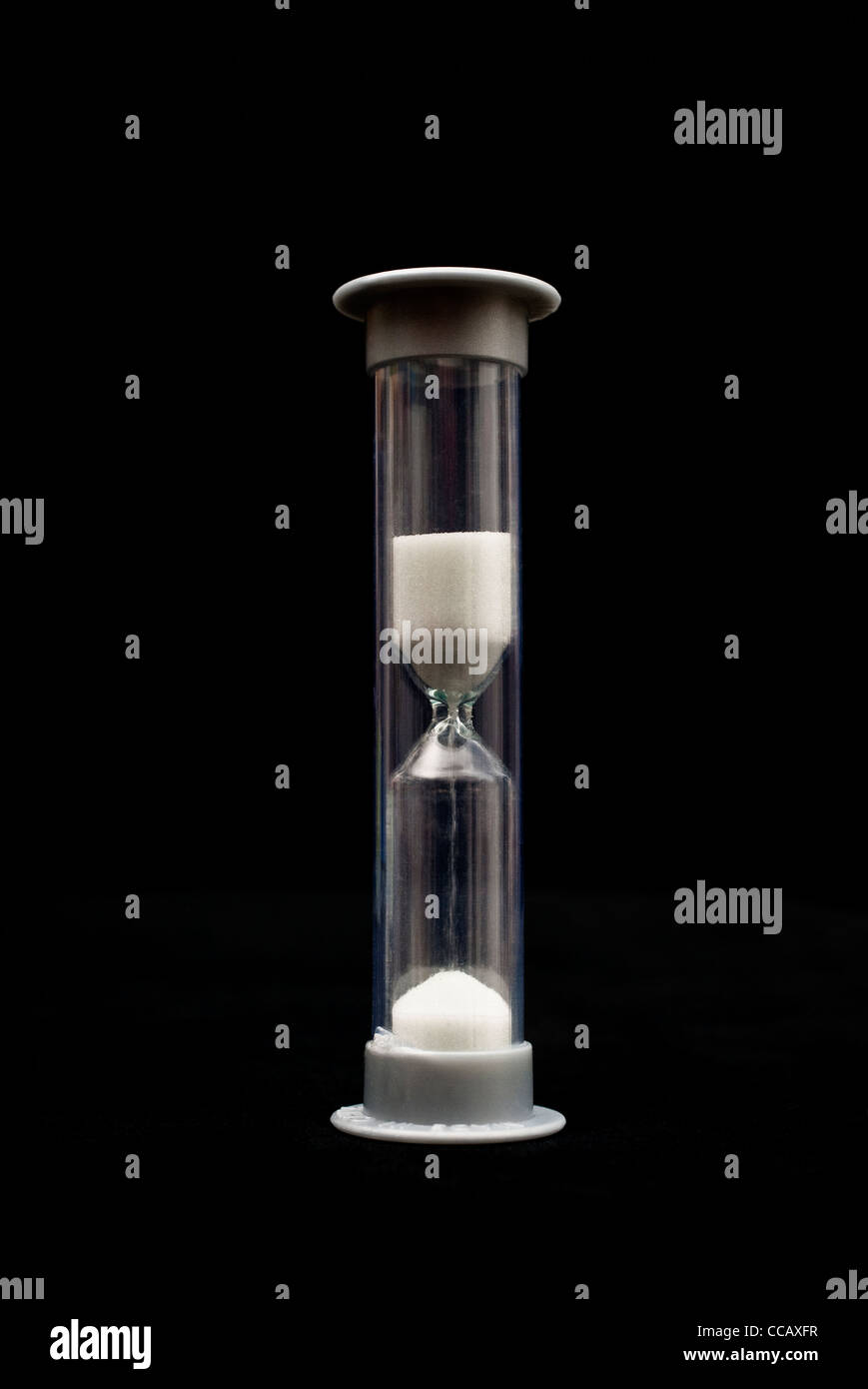 A small egg timer or hourglass, used for timing the boiling of an egg ...
