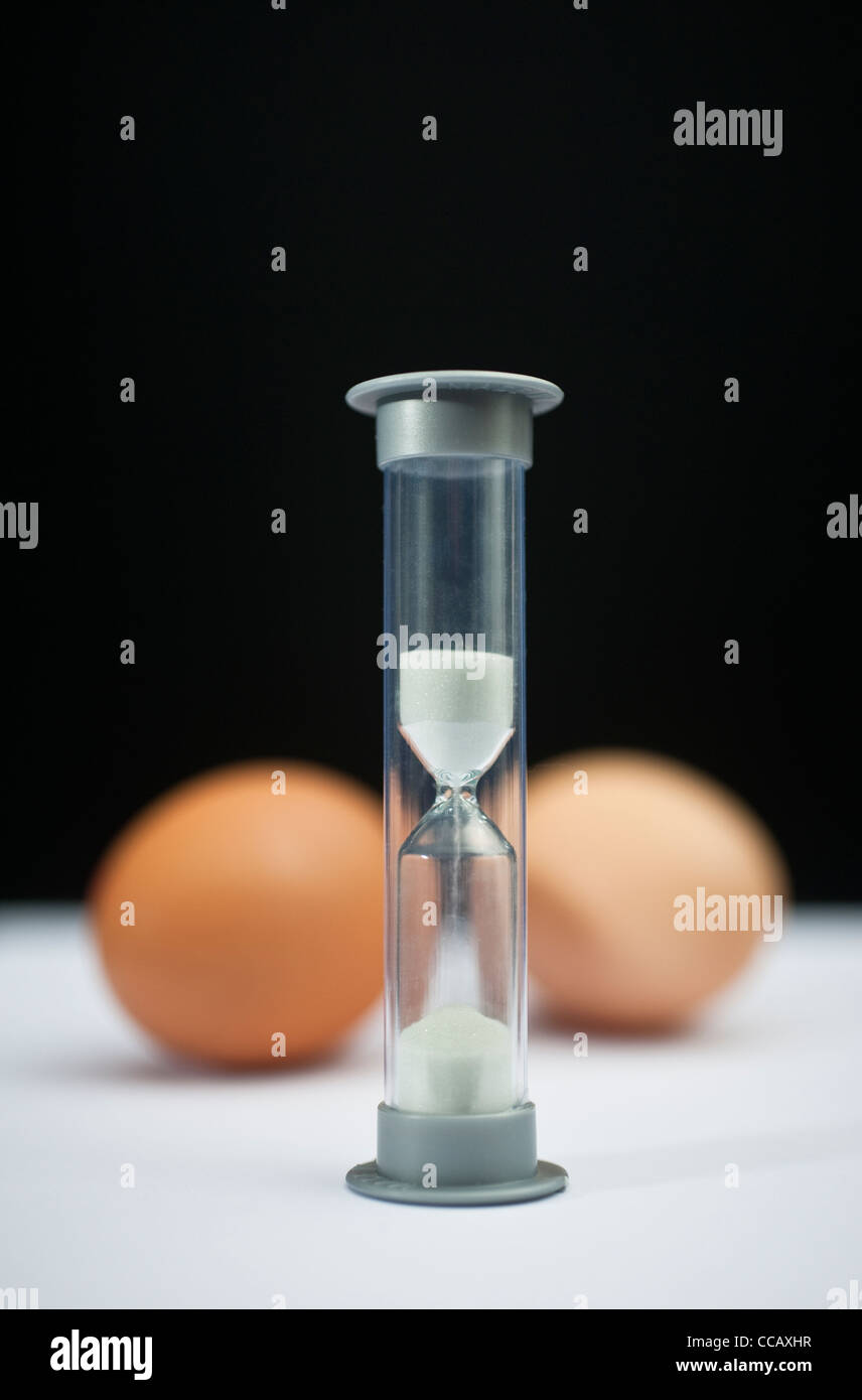 A small egg timer or hourglass, used for timing the boiling of eggs ...