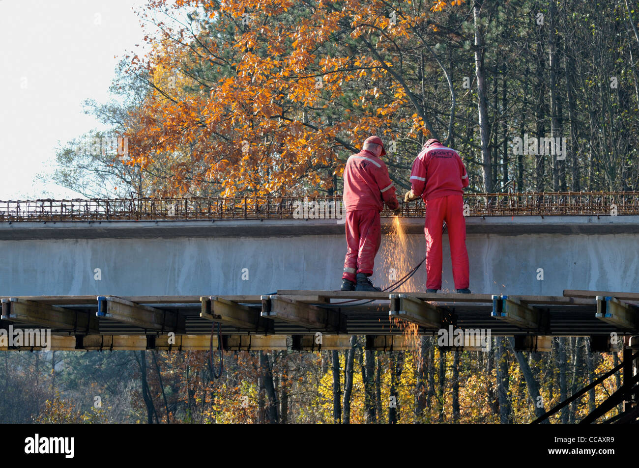 Construction workers working on the new bridge Stock Photo - Alamy
