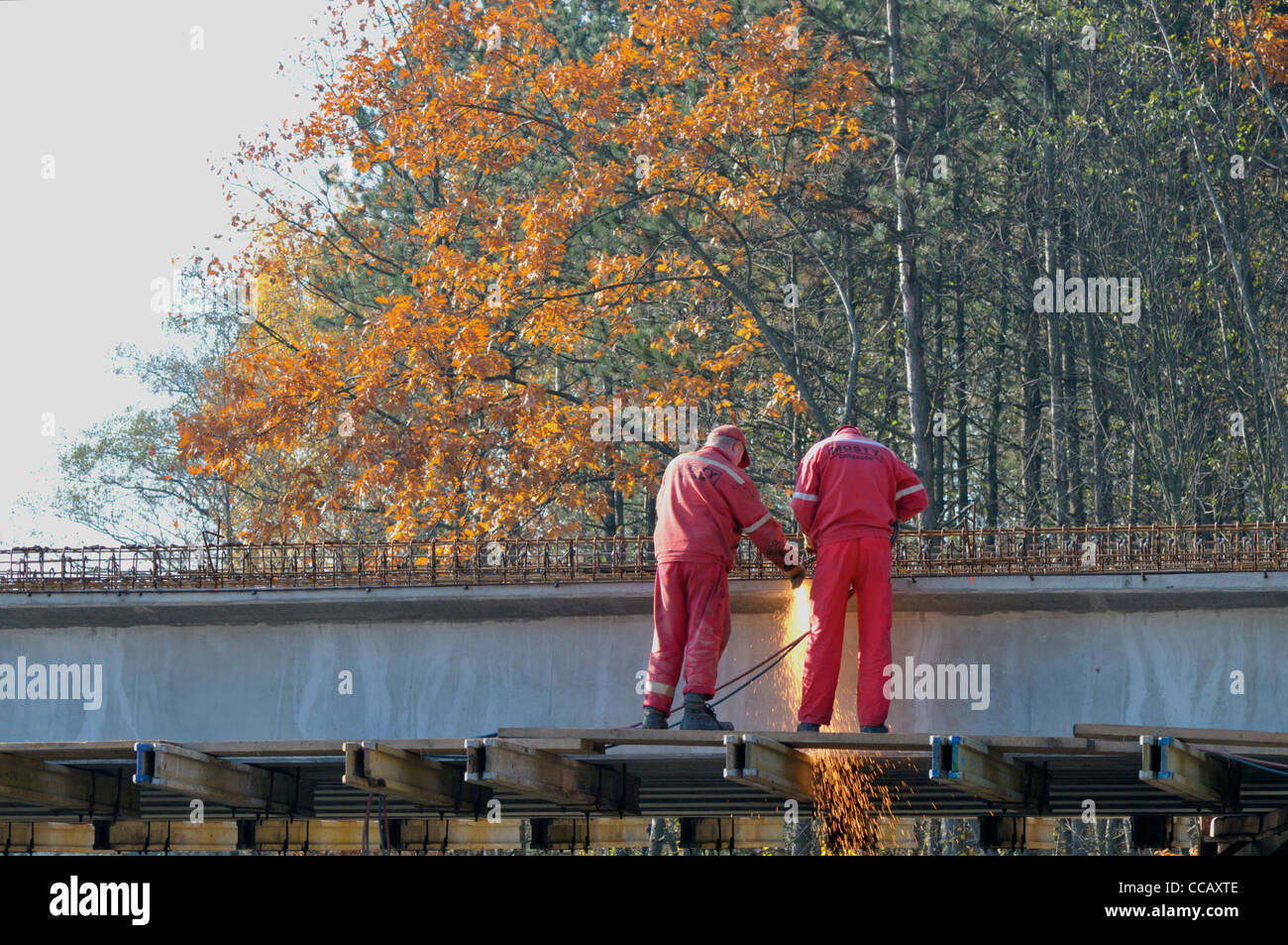 Construction workers working on the new bridge Stock Photo - Alamy