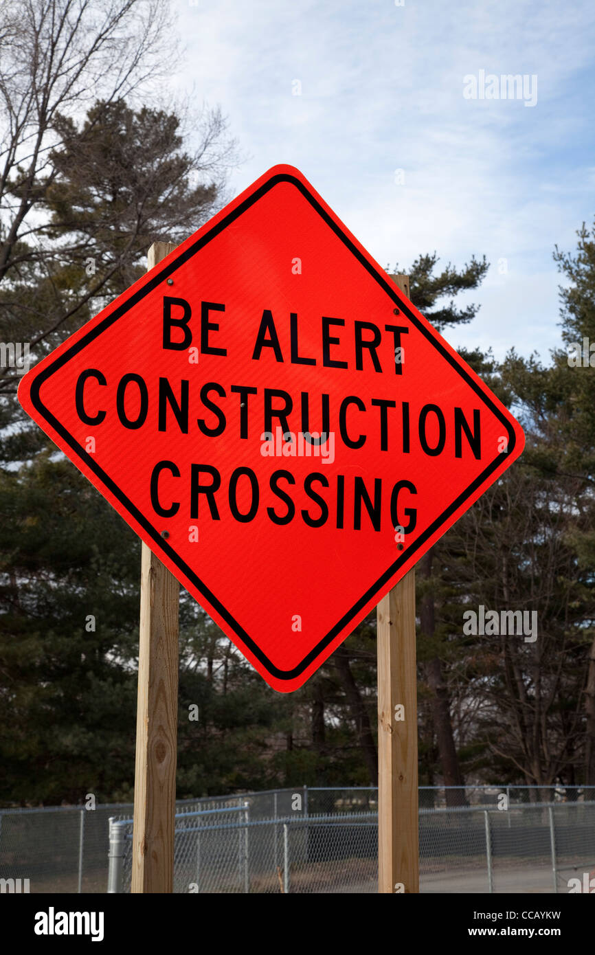 Be Alert Construction crossing sign Stock Photo - Alamy