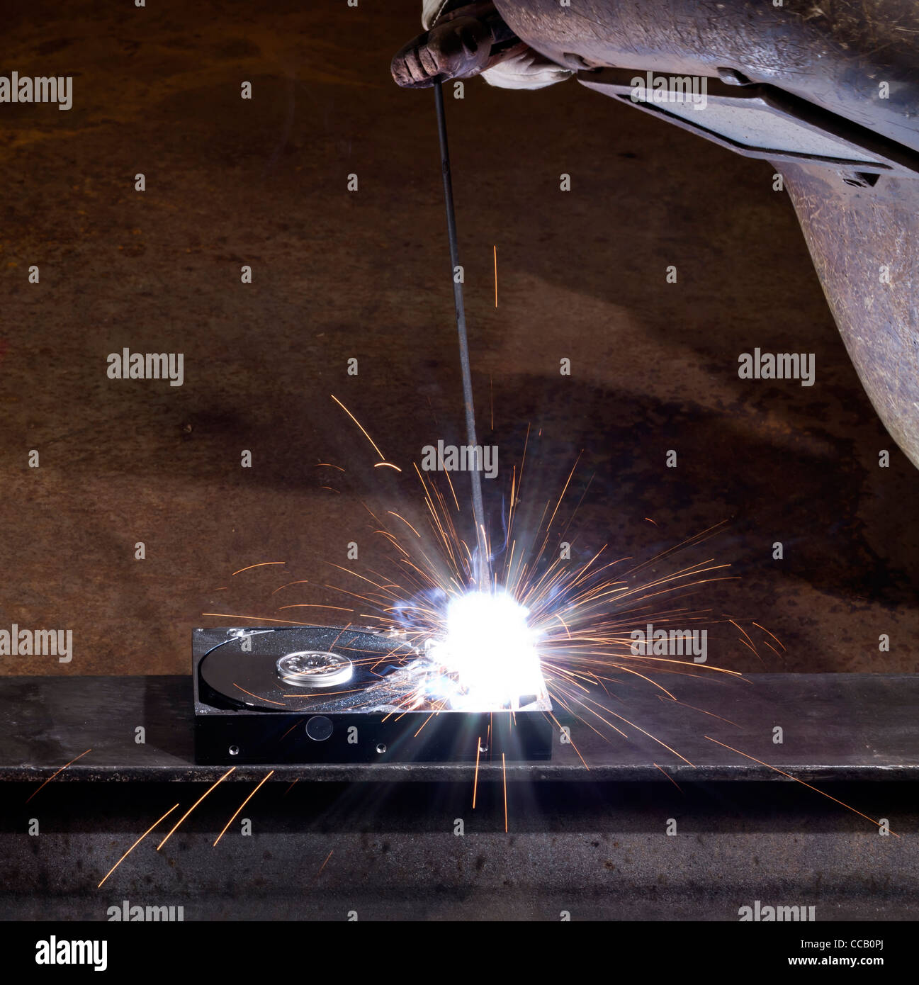 welding scenery with hard disk drive, welding mask detail and flashy ...