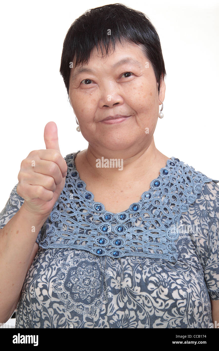 Happy Asian young woman give you an excellent gesture with friendly ...