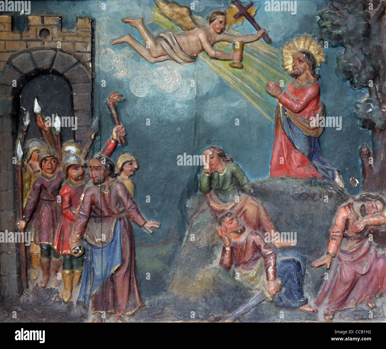 Jesus prays while the disciples sleep Stock Photo - Alamy