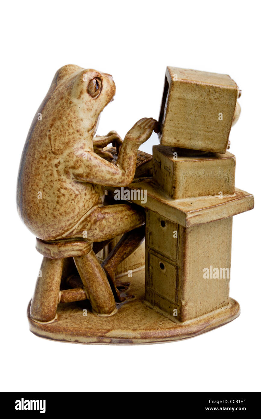 Pottery ornament depicting a frog using a computer Stock Photo - Alamy