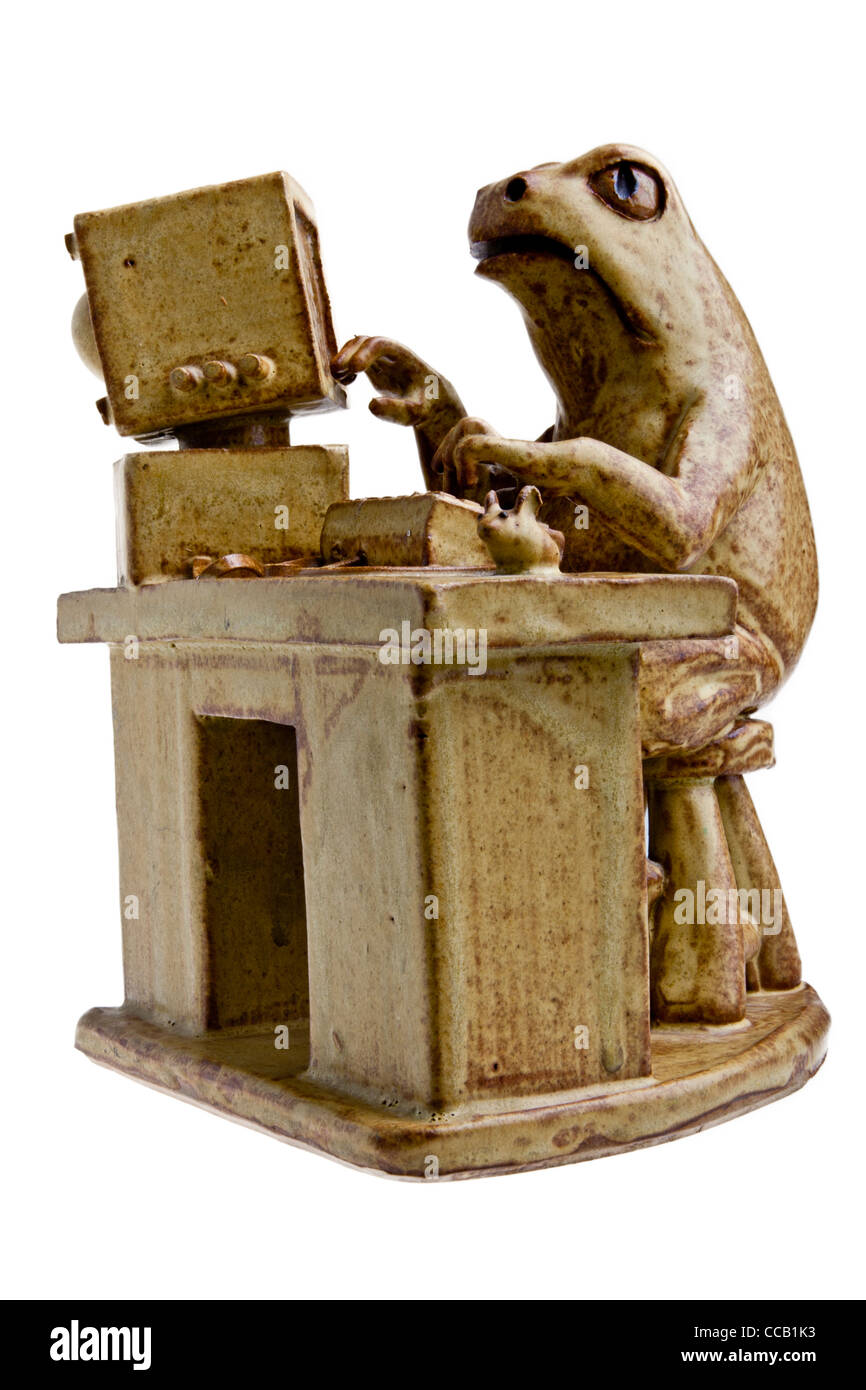 Pottery ornament depicting a frog using a computer Stock Photo - Alamy