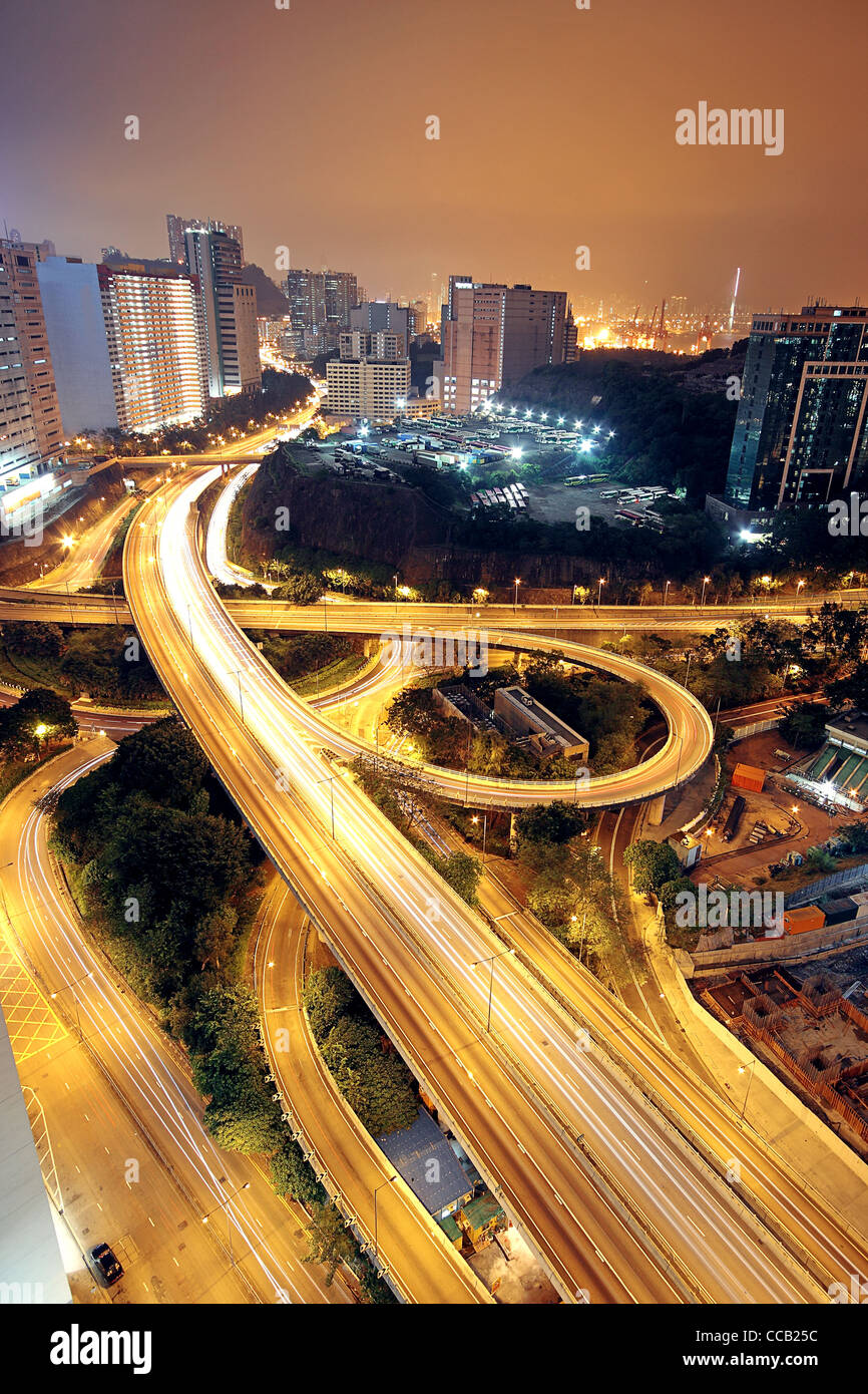 Freeway in night with cars light in modern city Stock Photo - Alamy