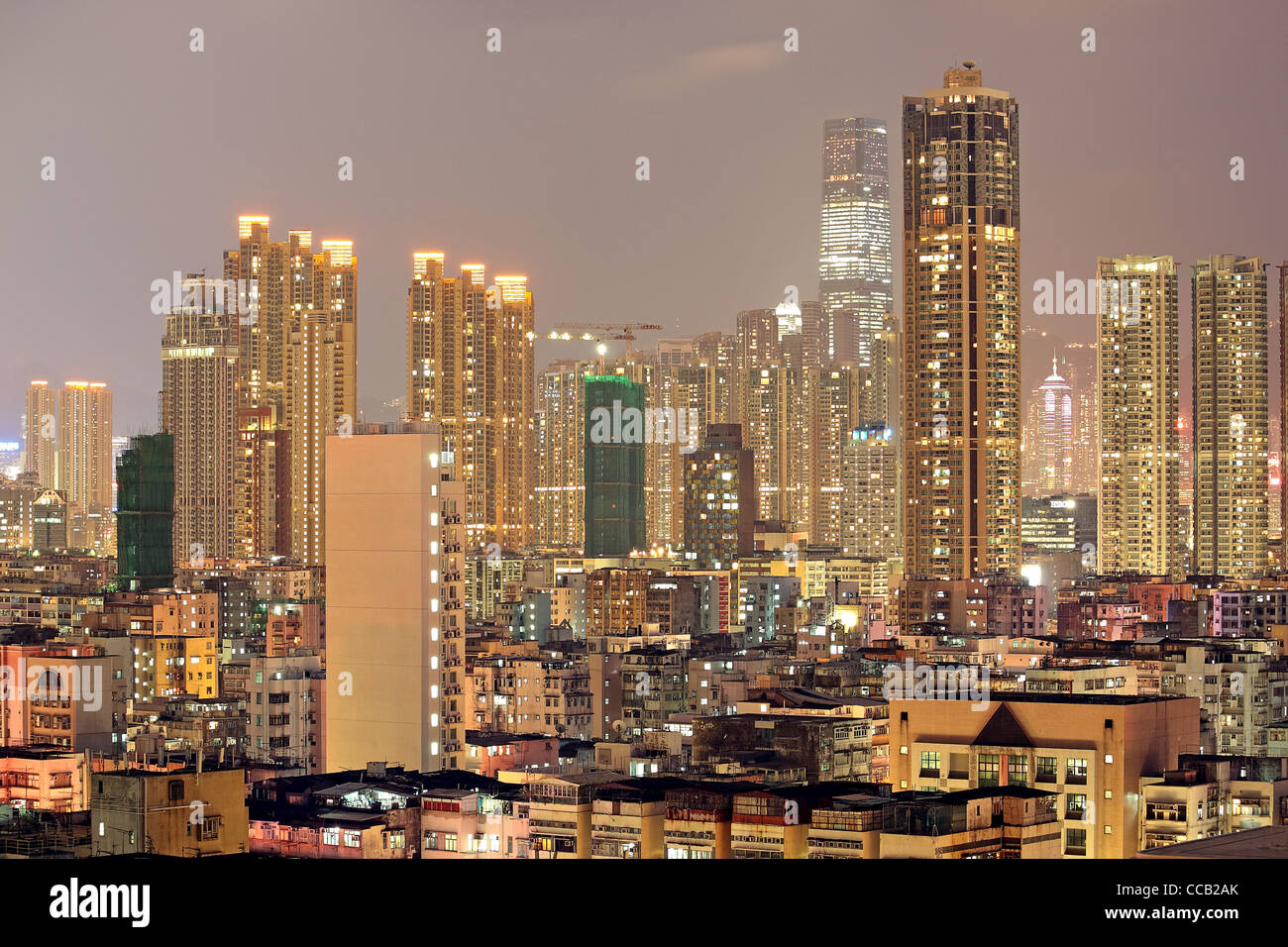 urban city at sunset with all lights lit up Stock Photo - Alamy