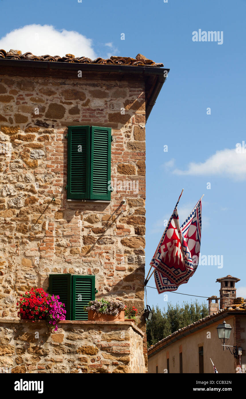 A typical shuttered building in the old medieval town of Montisi, Italy ...