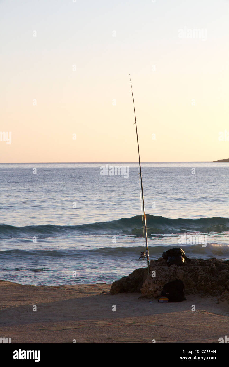 Fishing rod on beach Stock Photo - Alamy