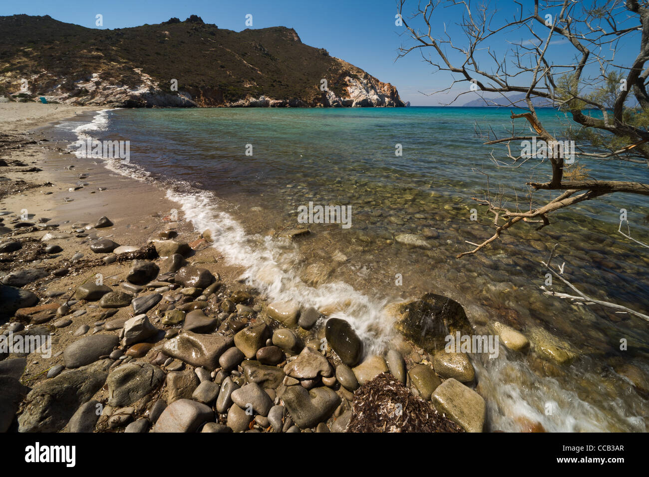 Waves washing rocks on isolated beach in Milos Island, Greece, Cyclades ...