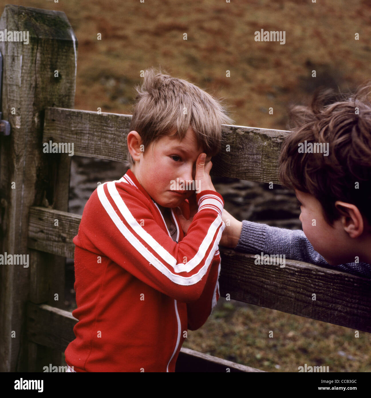 Upset child school boy in tears being shown compassion and empathy and ...
