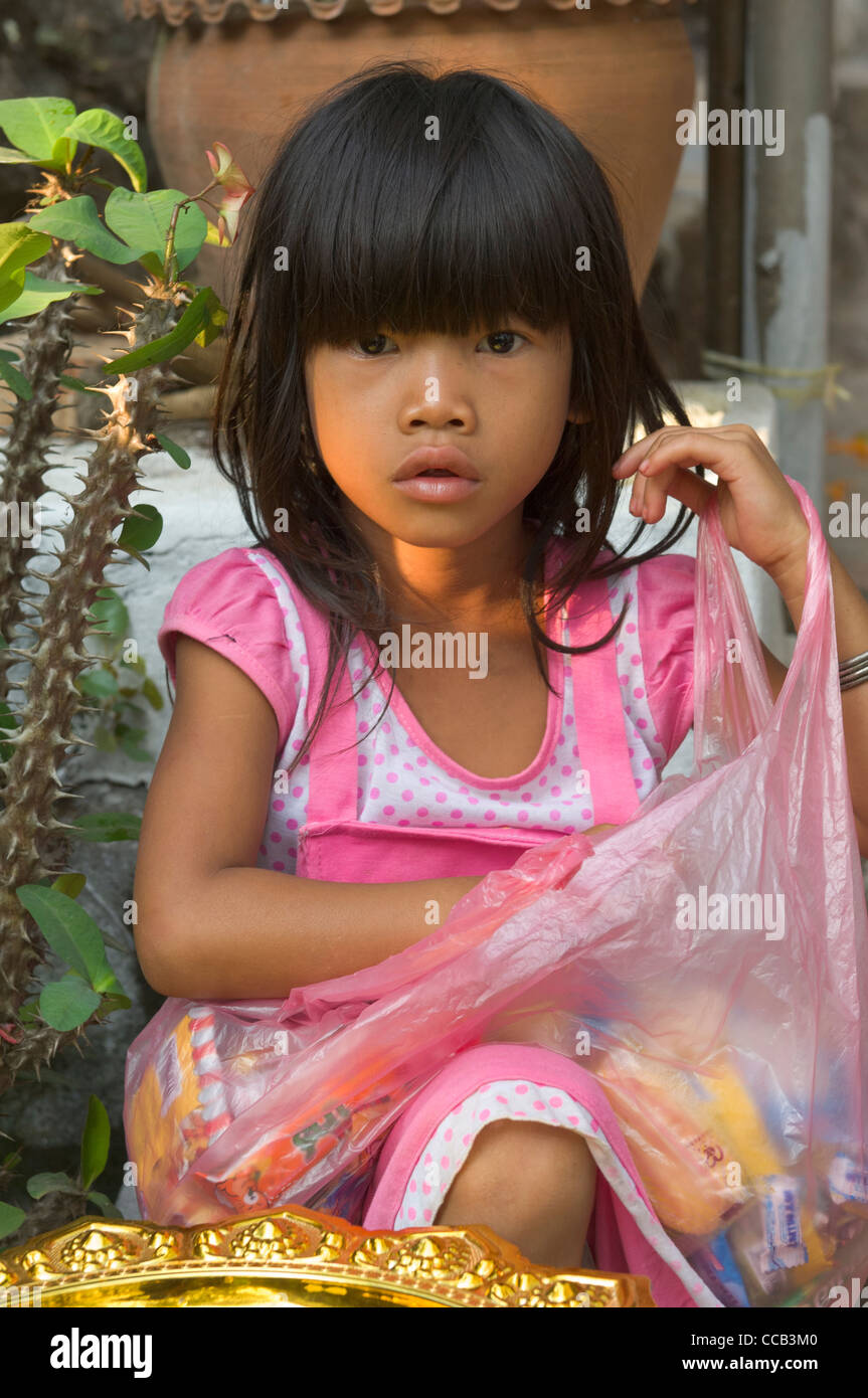 Lao girl waiting for sweets on Mount Phousi, on the first day of the ...