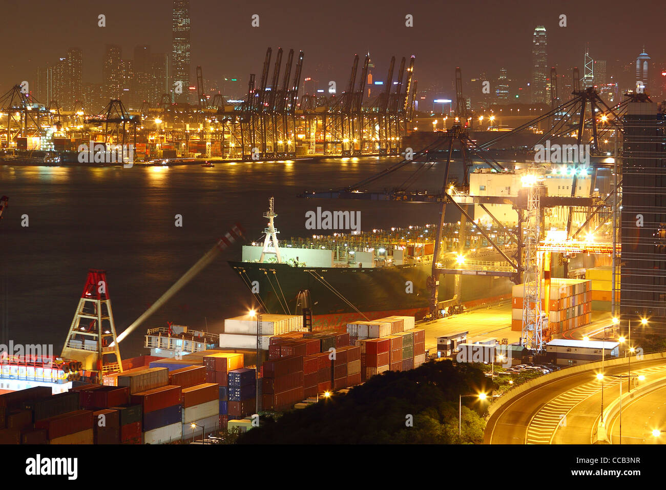 container terminal at night in city Stock Photo - Alamy