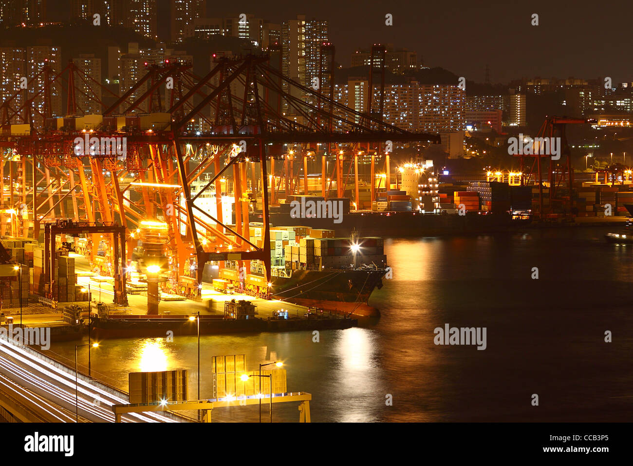 container terminal at night in city Stock Photo - Alamy