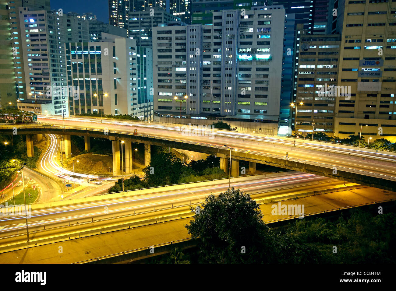 Colorful city night with buildings and bridge Stock Photo - Alamy