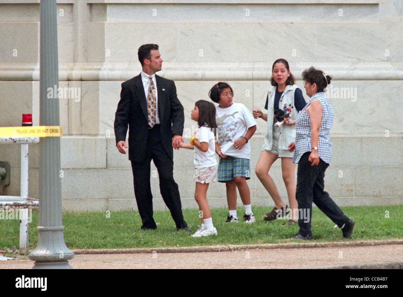 Police escort witnesses from the US Capitol after a shooting erupted on ...