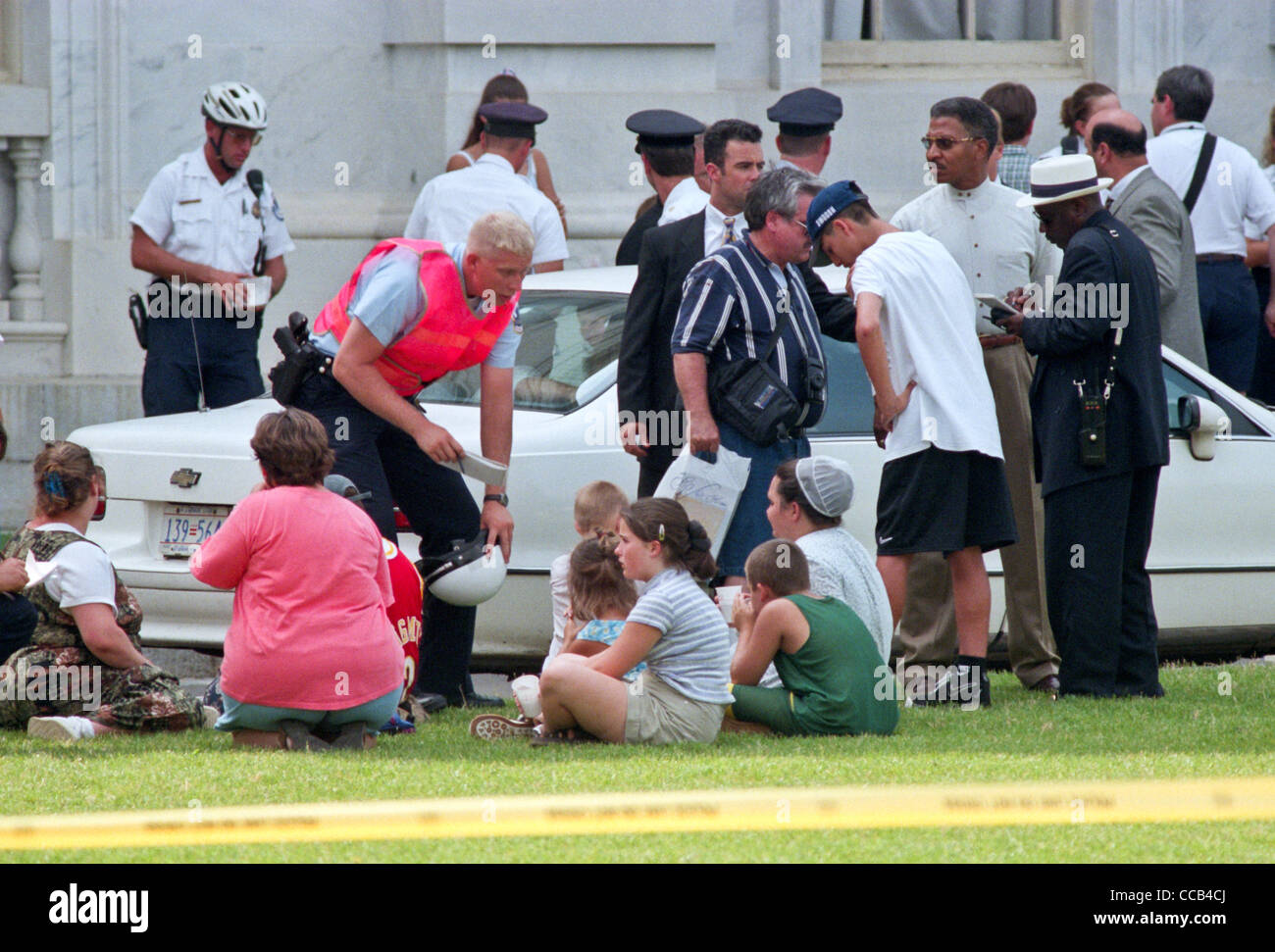 Police officers take statements from witnesses after a shooting erupted ...
