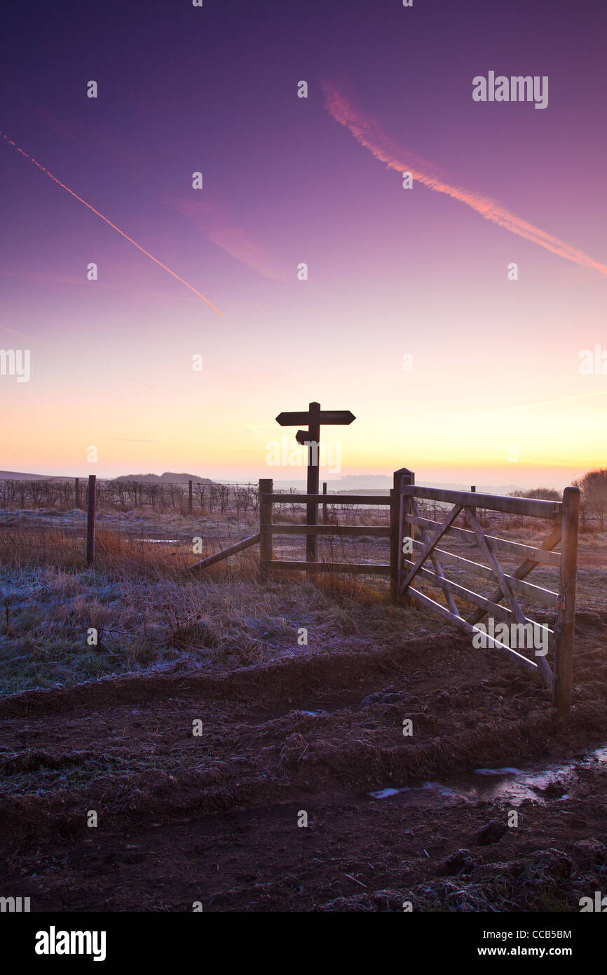 A frosty winter sunrise over the Ridgeway long distance path at Hackpen ...