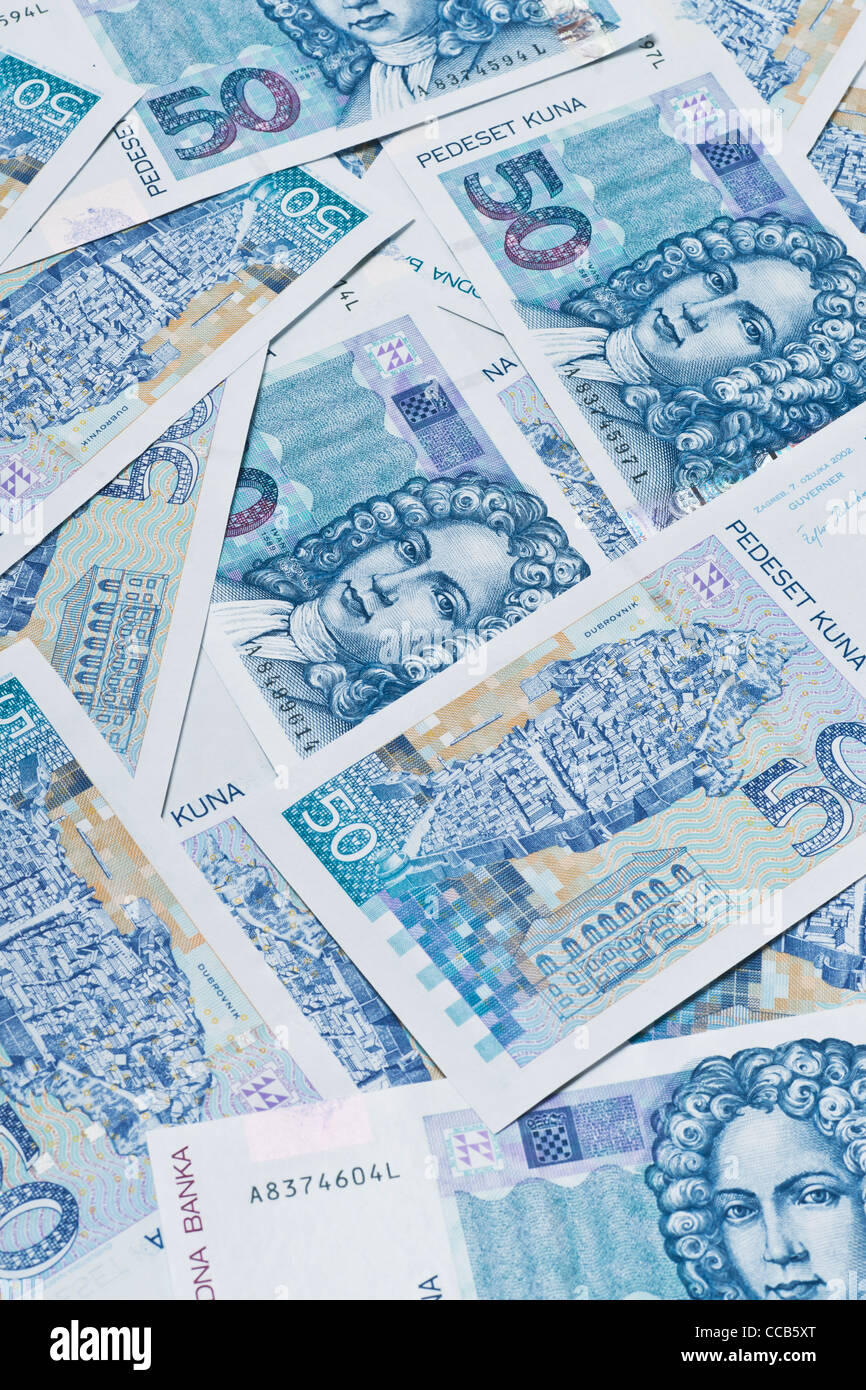 50 kuna banknotes lie side by side. The Banknotes are the official ...