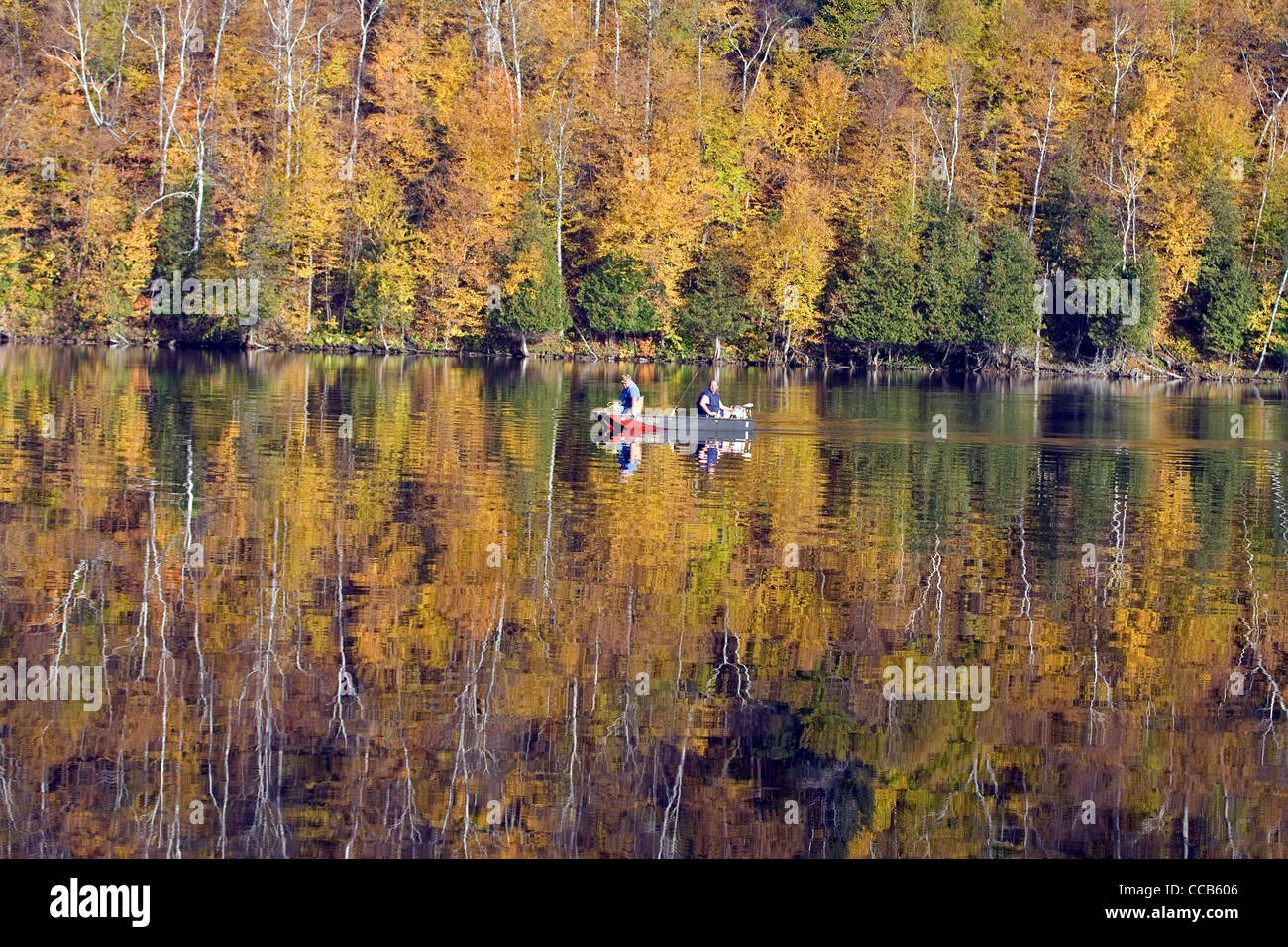 Craftsbury Vermont VT colorful fall foliage reflected in Lake Eligo ...