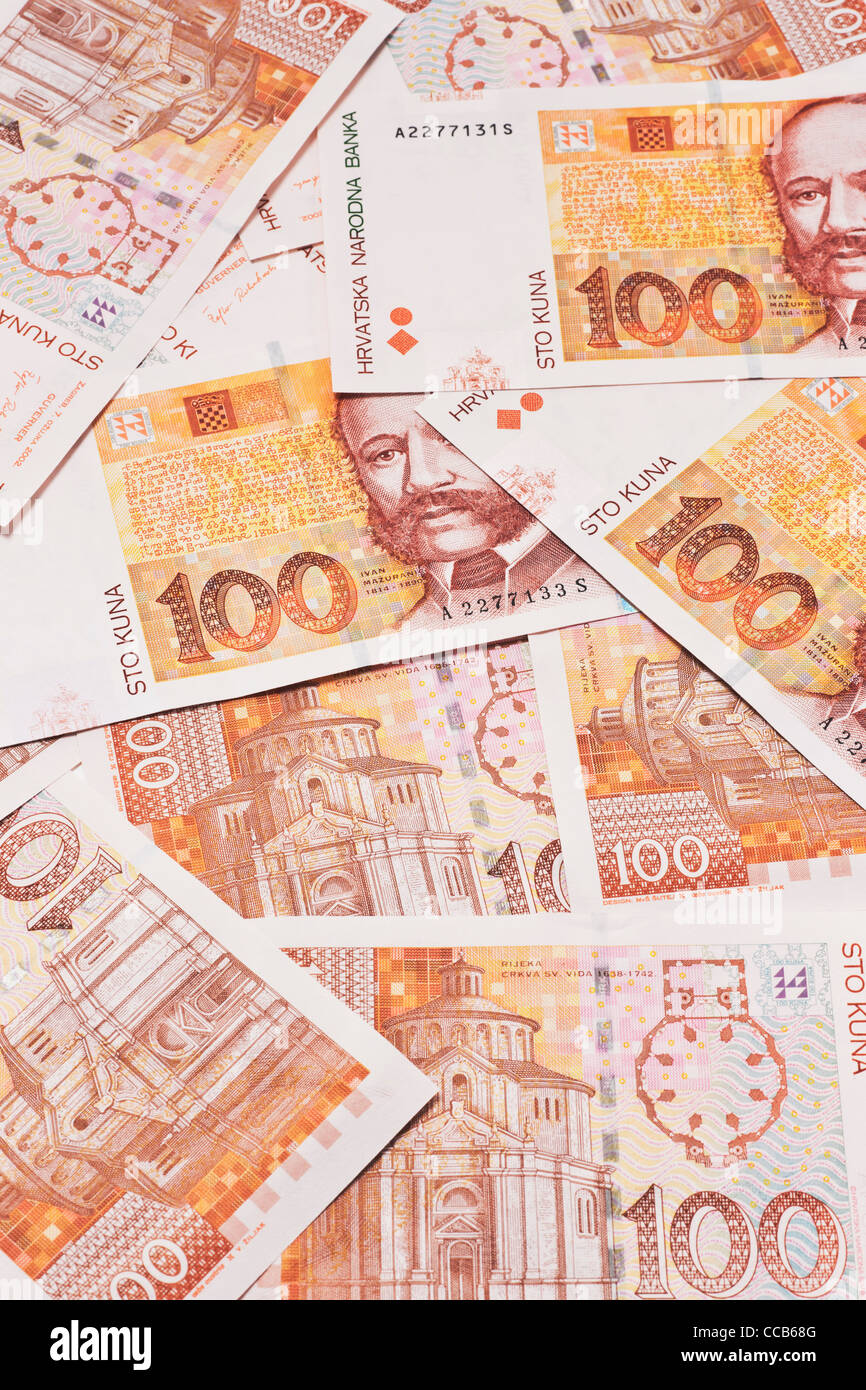 100 kuna banknotes lie side by side. The Banknotes are the official ...