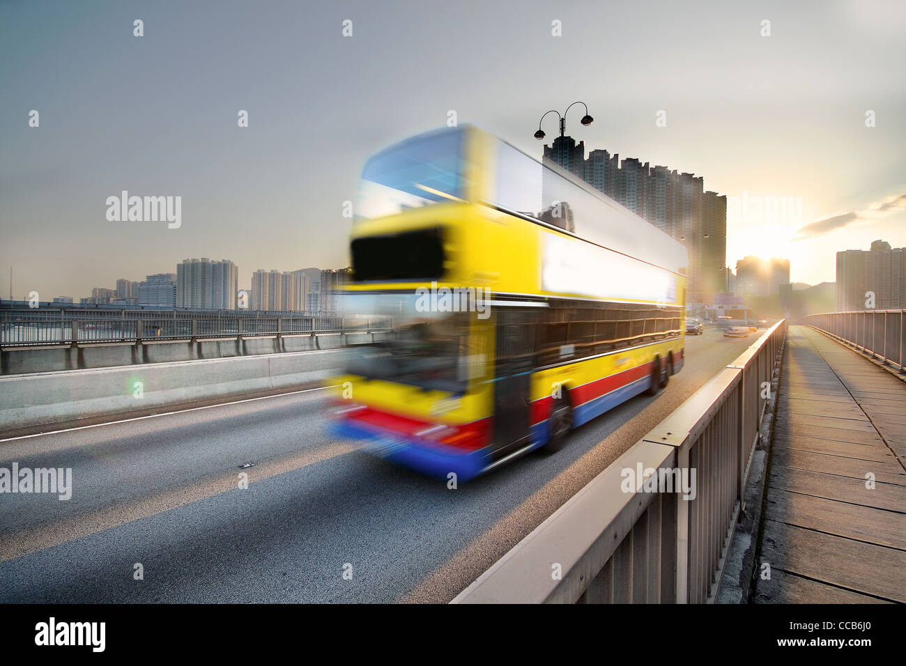 speed bus through sunset road Stock Photo - Alamy