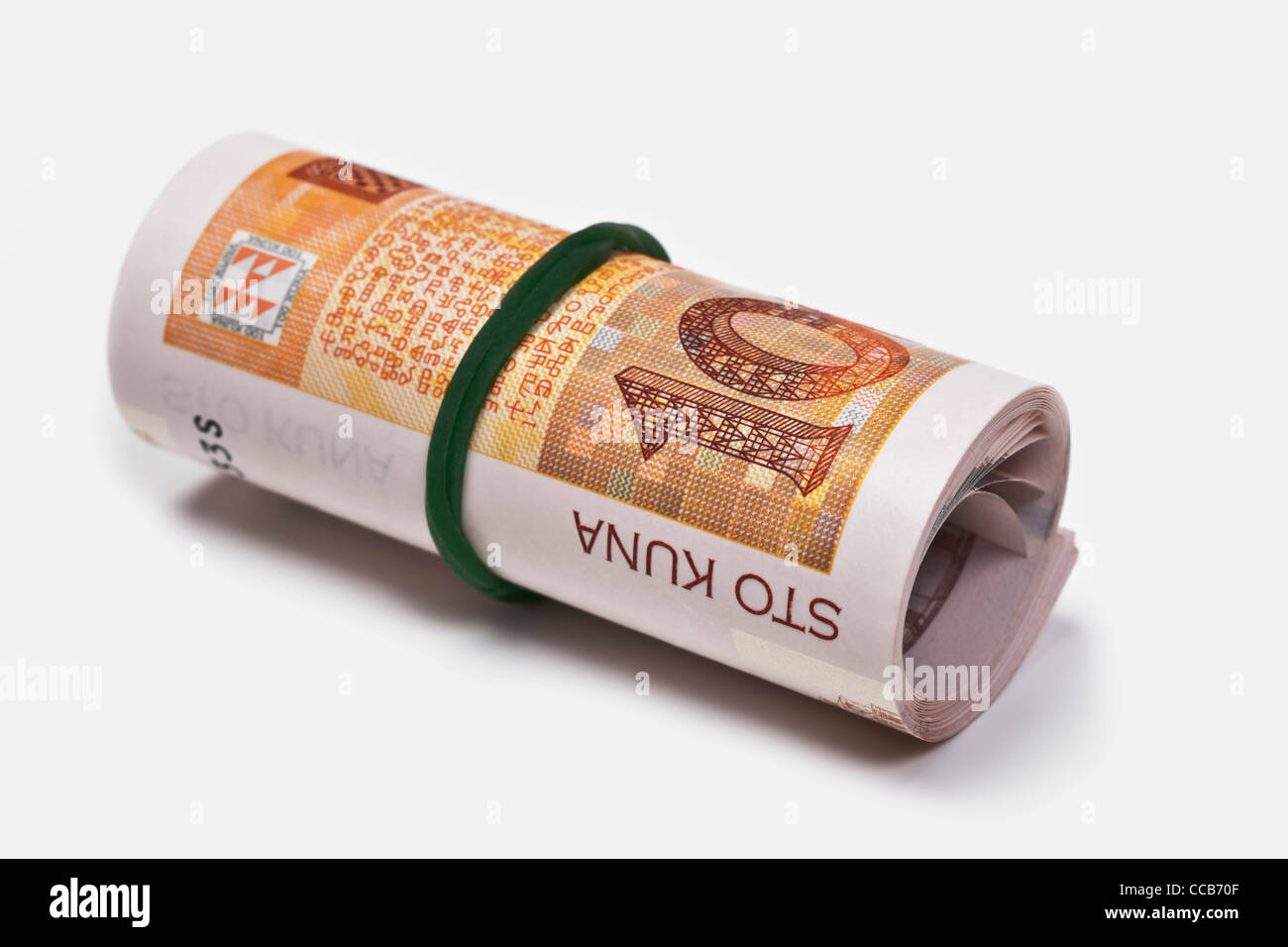 many 100 kuna banknotes, rolled up and held together with a rubber ...
