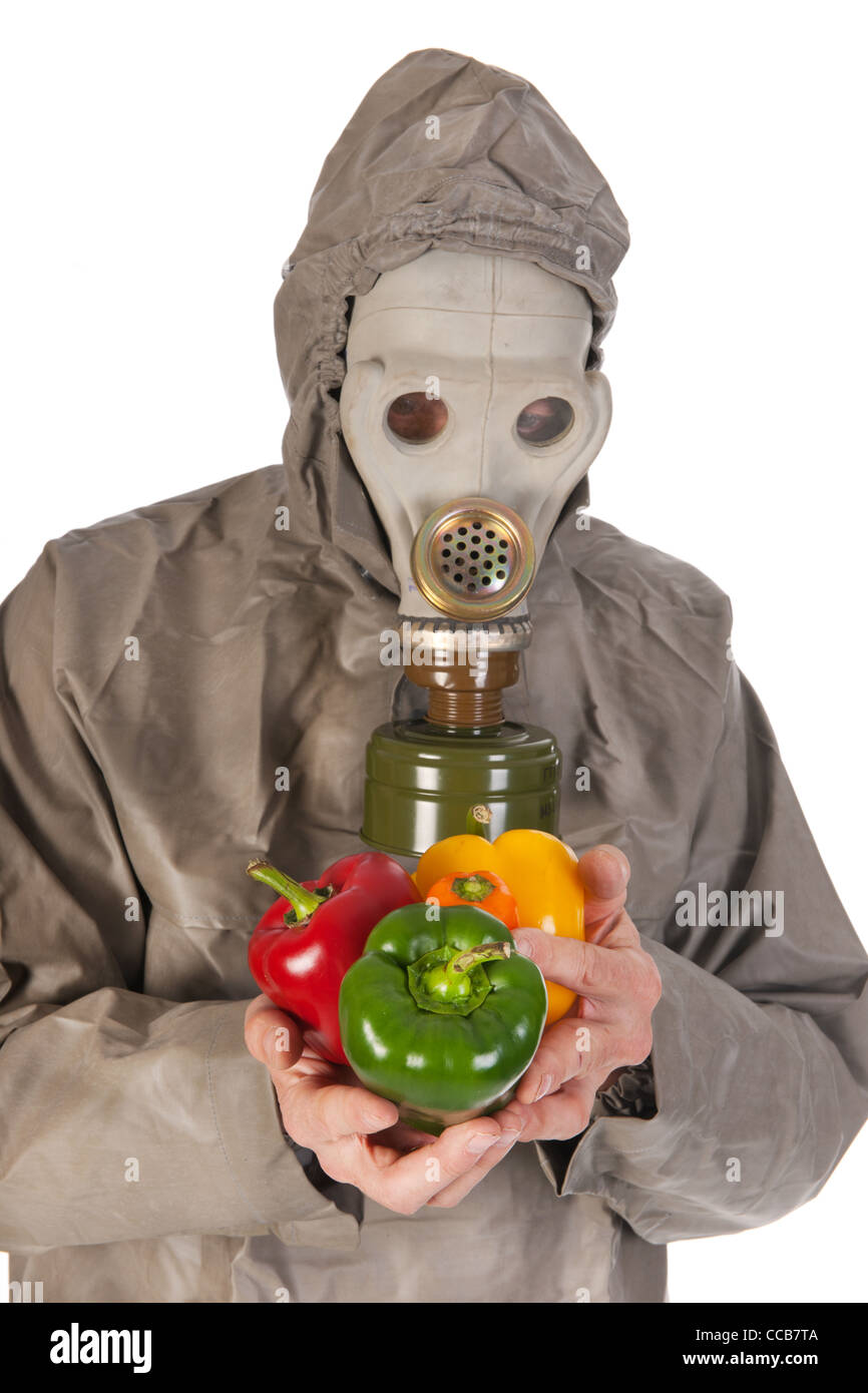 Man with protection suit and gas mask is holding paprika Stock Photo ...