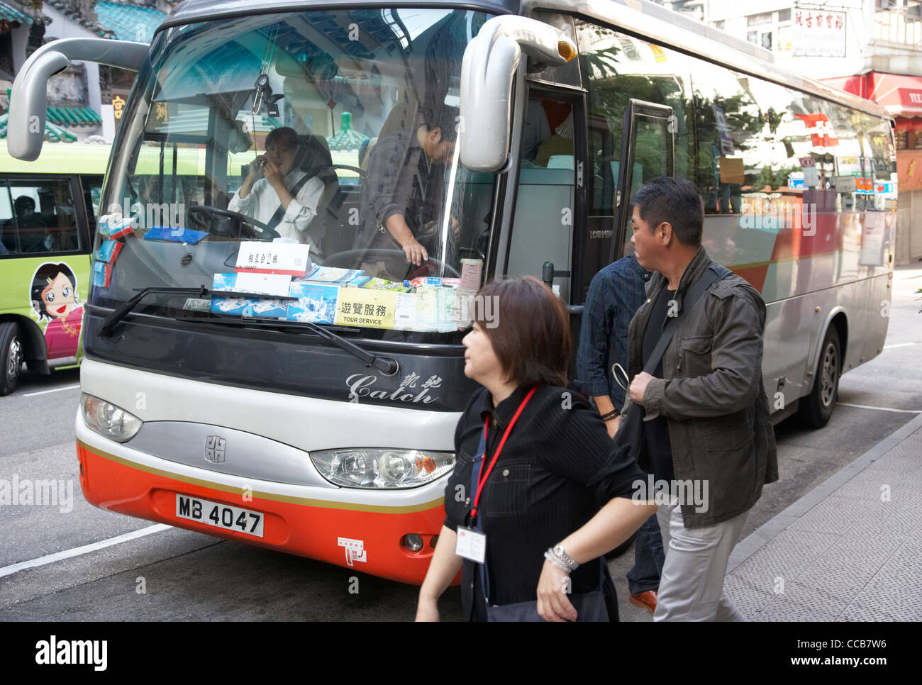 mainland chinese tourists getting off tour bus coach in hong kong hksar ...