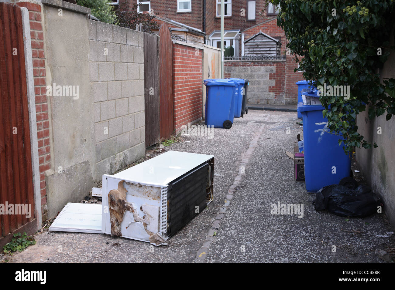 Fly tipped fridge in an alley in Norwich, UK Stock Photo - Alamy