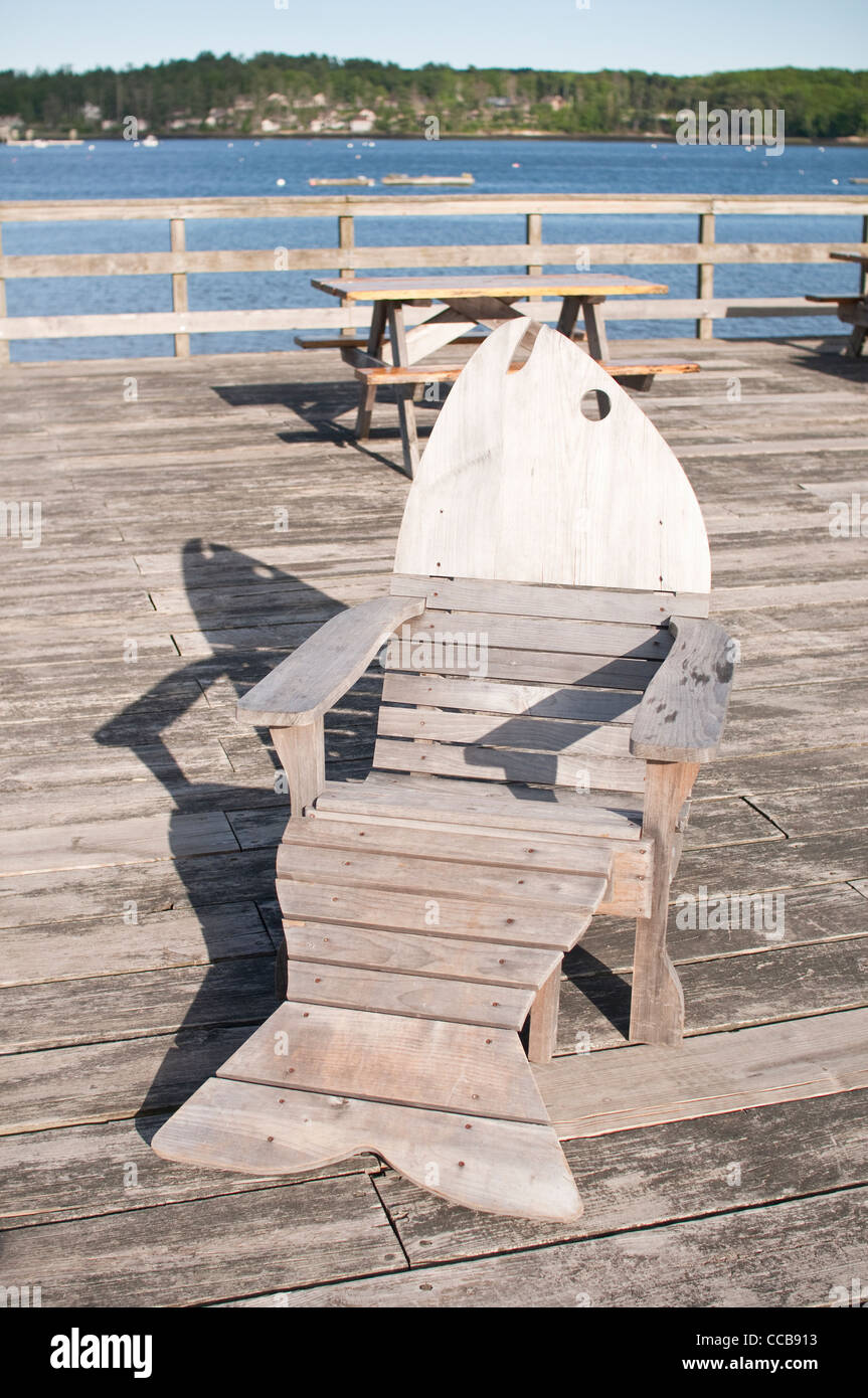 A fish-shaped wooden chair on the outdoor seating terrace at Sprague's ...