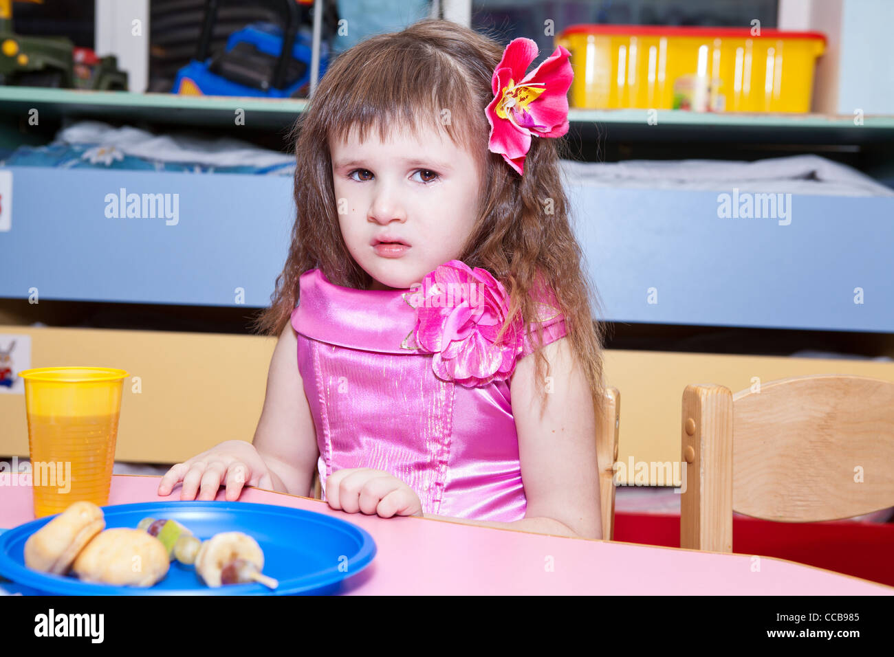 Children in Russian kindergarten sitting at the dinner table and eating ...