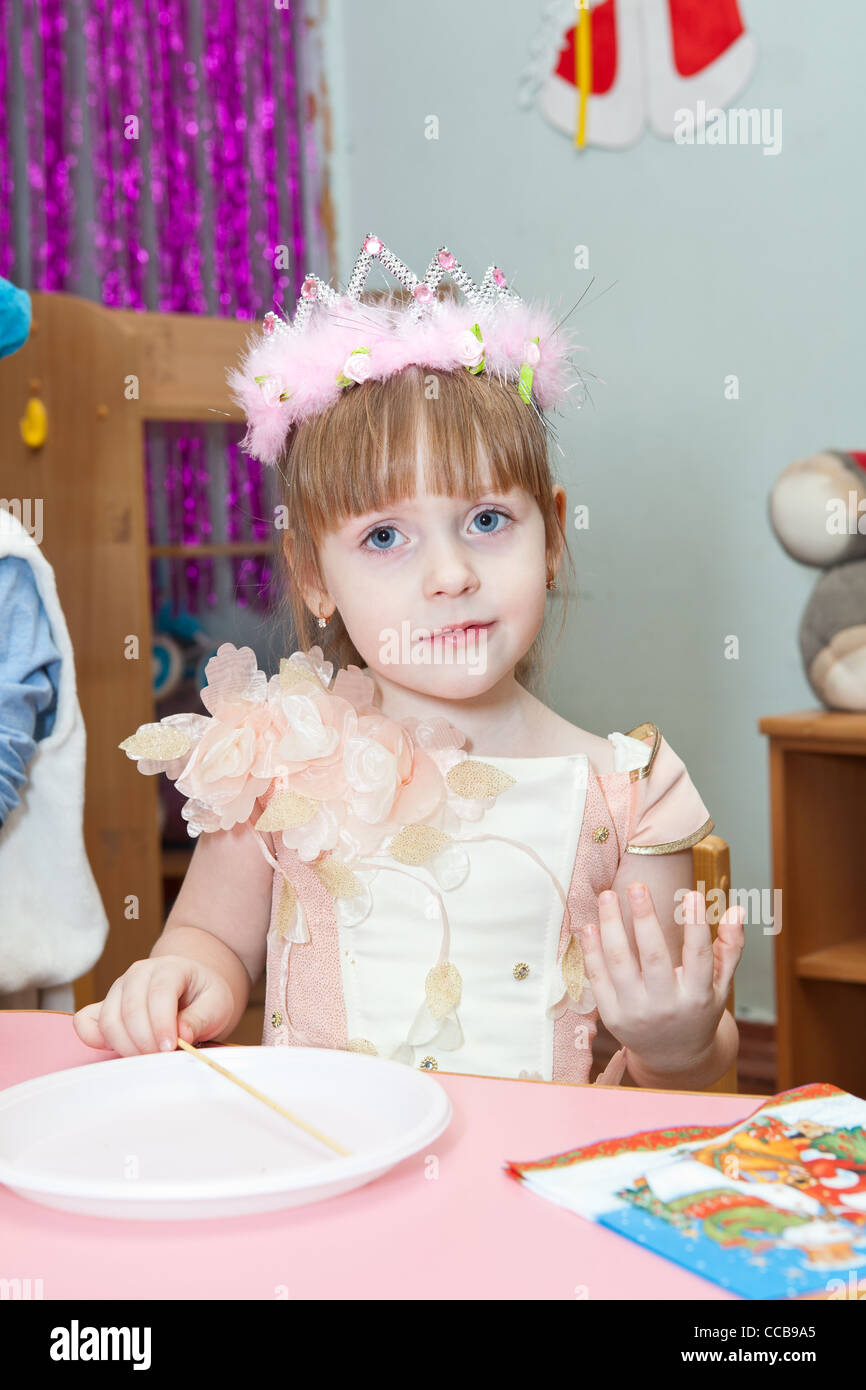 Children in Russian kindergarten sitting at the dinner table and eating ...