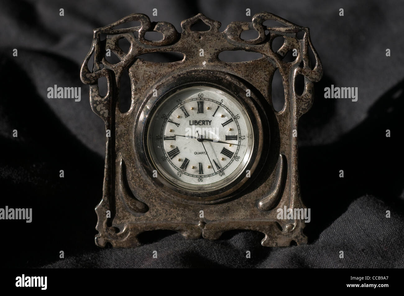 Art nouveau style clock, 3"x3" approximately in size Stock Photo - Alamy