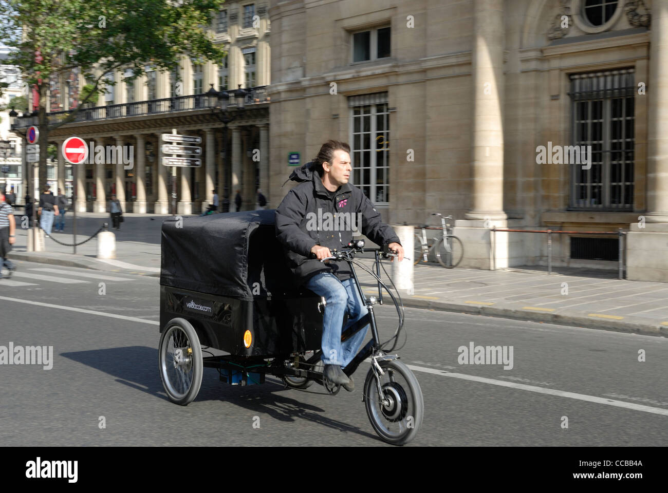 Man riding tricycle on street hi-res stock photography and images - Alamy