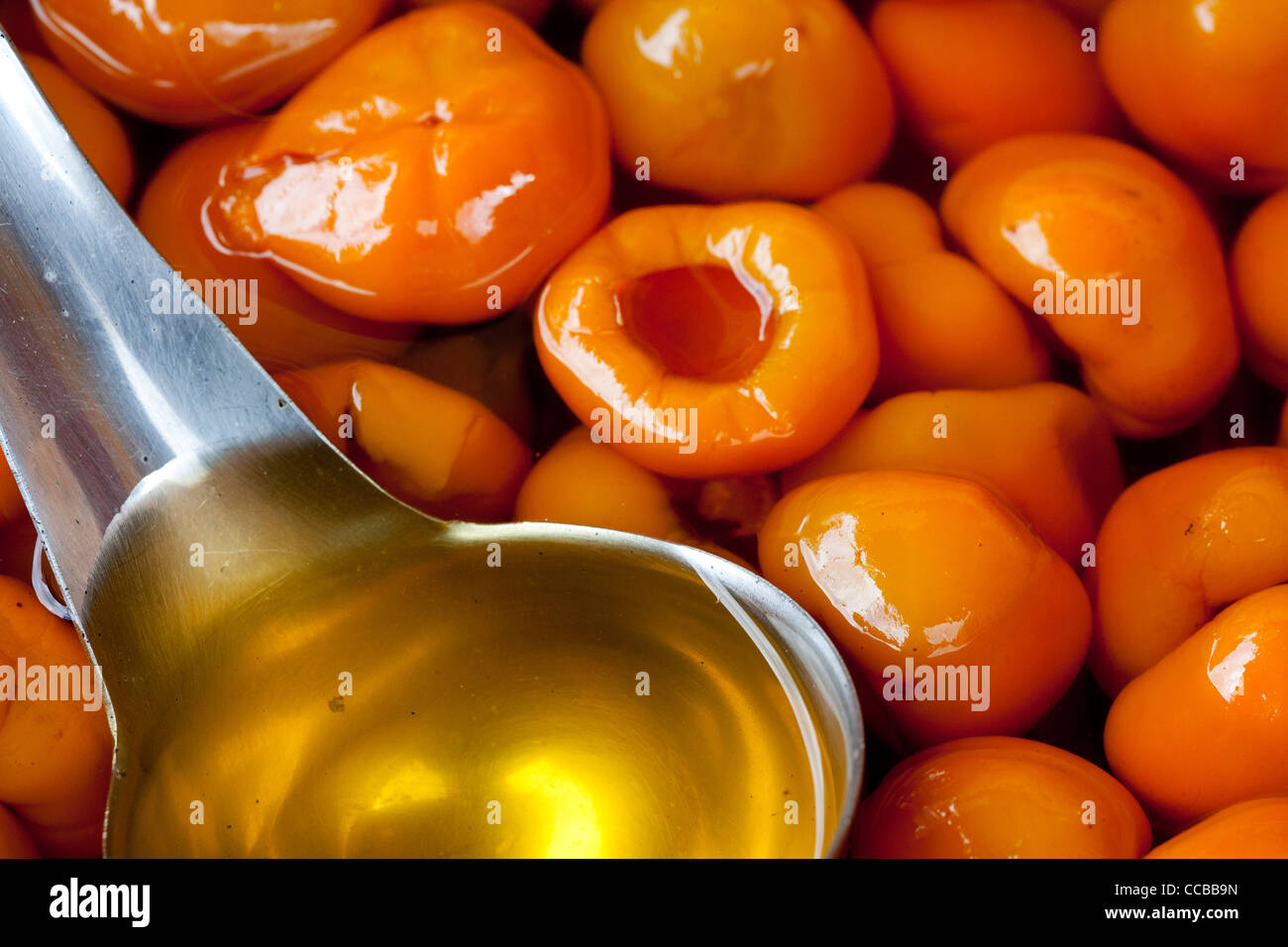 apricot and ladle in juice Stock Photo - Alamy