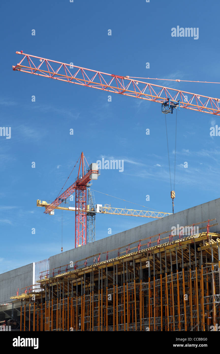 The crane elevating against the blue sky Stock Photo - Alamy