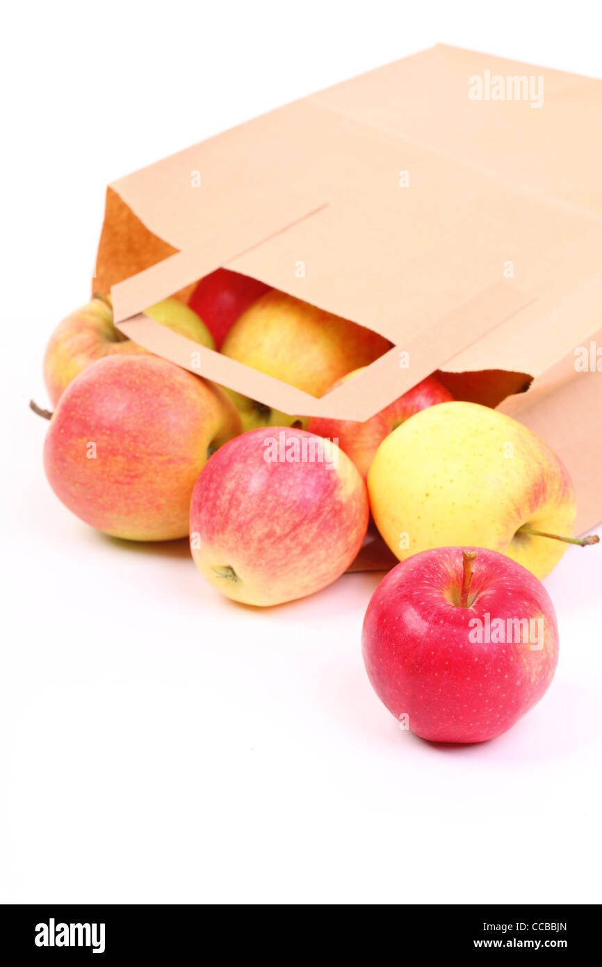 Shopping brown recycle gift bags and red apple isolated on white ...