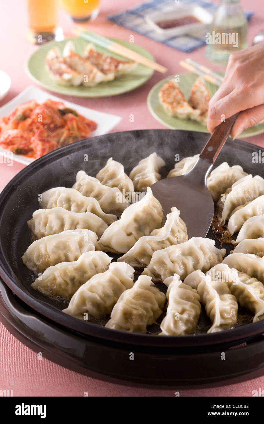 Pot Sticker on Hot Plate Stock Photo - Alamy